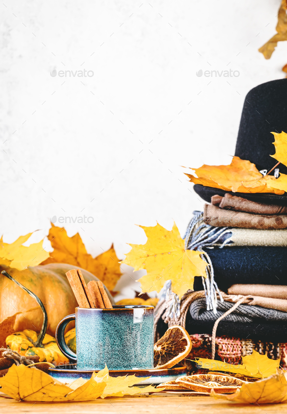 Autumn hot drink in white cup on fall background with pumpkins, spices ...