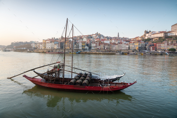 Traditional Rabelo boat with wine barrels at Douro River with Porto ...