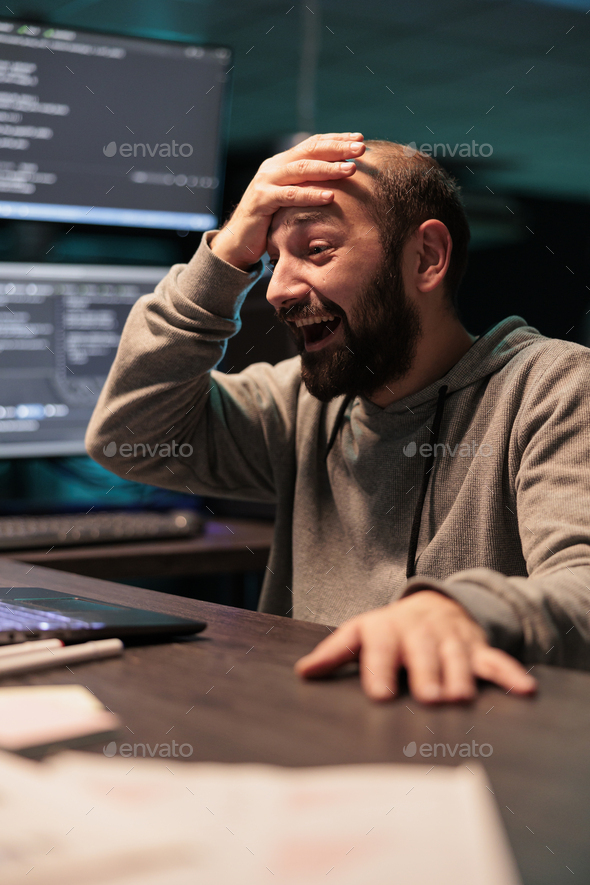Pleased smiling coder celebrating data script success Stock Photo by DC ...