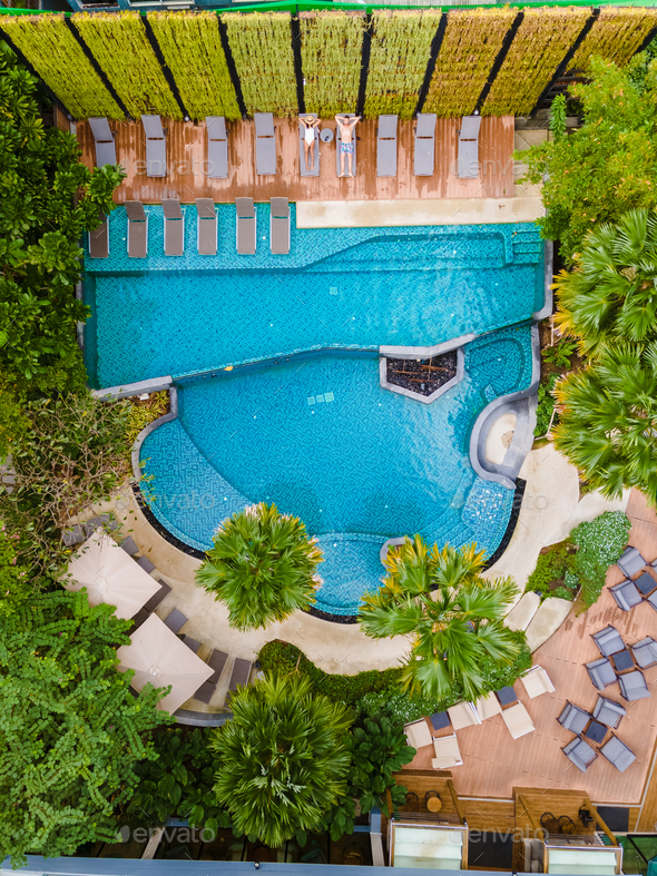 Drone view from above at swimming pool, couple men and women in ...