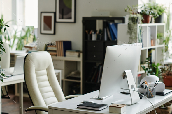 Computer monitor standing on workplace of office worker Stock Photo by ...