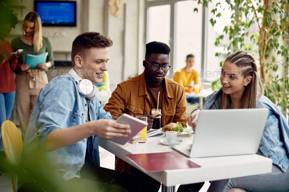 University students using laptop while going through lecture during ...
