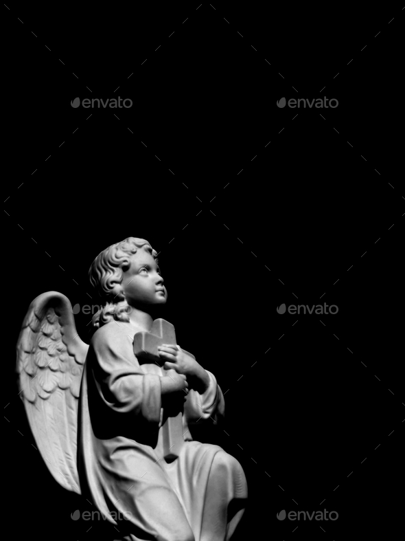 Statue of an angel holding a cross looking up to heaven Stock Photo by ...