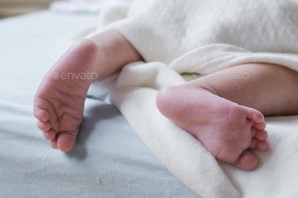 Light and airy shot of a baby’s feet. Stock Photo by jonathancant ...