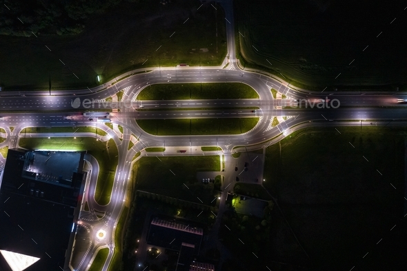 night over road junction, intersection road with cars with headlights ...