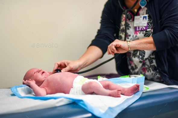Newborn baby getting a checkup at the pediatrician’s office Stock Photo ...