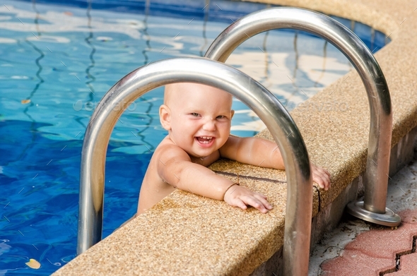 Funny baby in the swimmin pool Stock Photo by nikitavas | PhotoDune