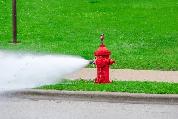 Red fire hydrant spraying water Stock Photo by krisprahl | PhotoDune