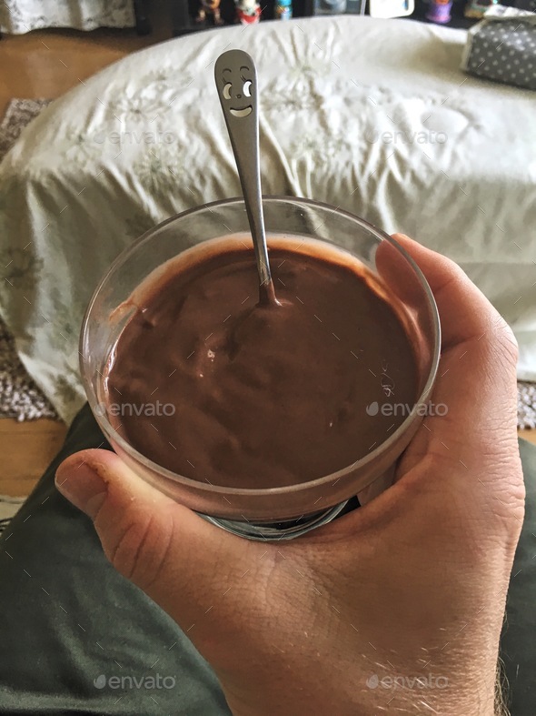 Chocolate pudding with a smiley spoon Stock Photo by jonathancant
