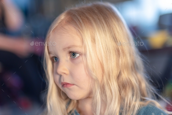 Serious portrait of bored sad little girl Stock Photo by krisprahl