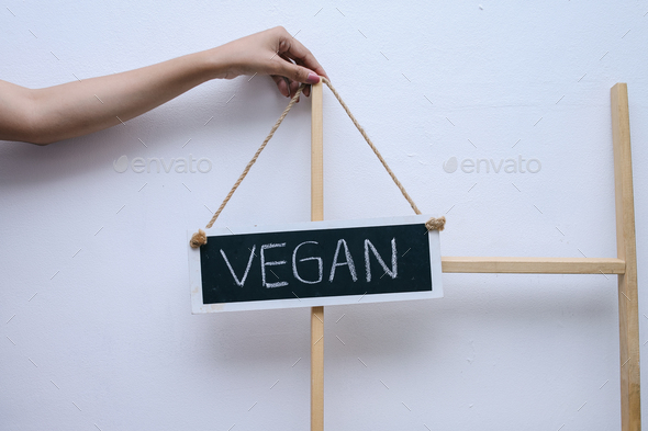 Vegan message written on mini blackboard Stock Photo by Queenmoonlite35