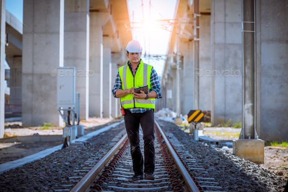 engineer under inspection and checking construction process railway ...