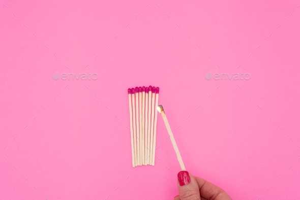 Lighted matchstick on pink background Stock Photo by krisprahl | PhotoDune
