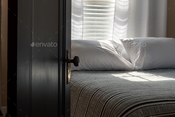 Partially open bedroom door in early morning - home interior Stock ...