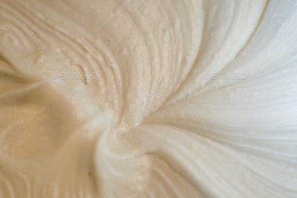 Textured swirls and peaks of raw cake batter Stock Photo by krisprahl
