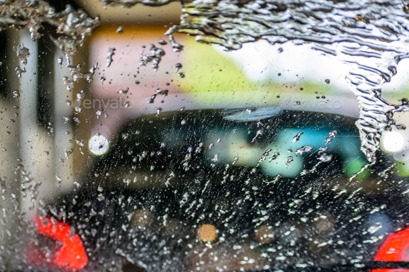 Water spraying the windshield at the car wash Stock Photo by krisprahl