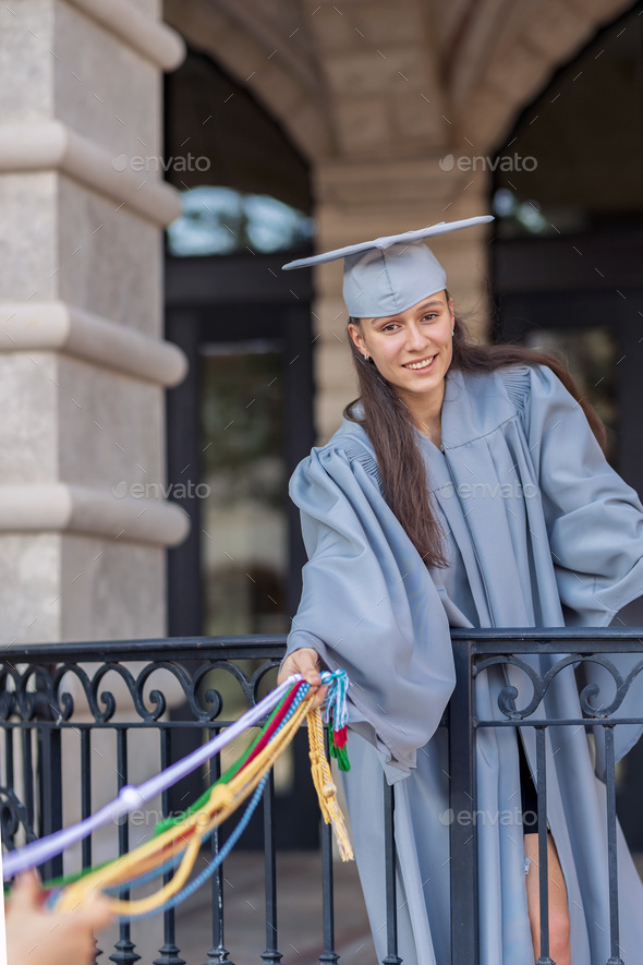 People from behind graduation gown and cap future college life new life ...