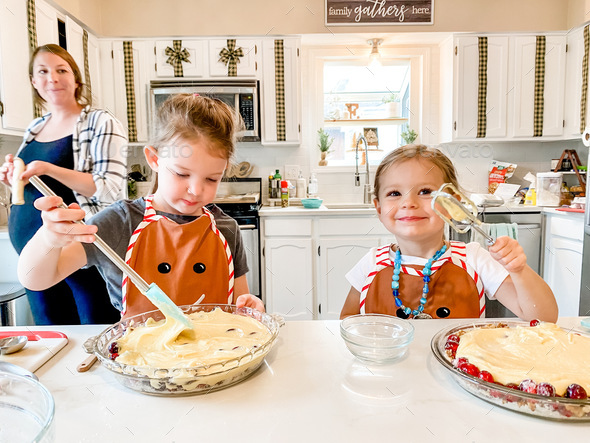 Two cute little girls making holiday pies Stock Photo by krisprahl