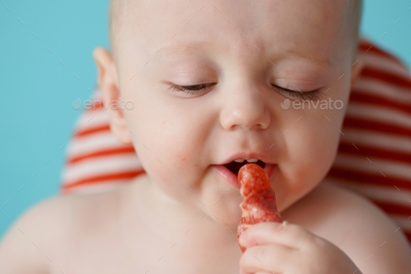 child eats meat Stock Photo by Repnitskaya | PhotoDune