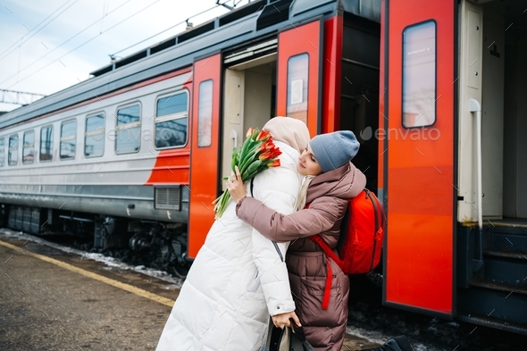 girls say goodbye hugging on the station platform Stock Photo by ...