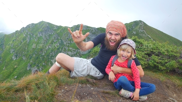 Dad and daughter climb the mountain Stock Photo by nikitavas | PhotoDune