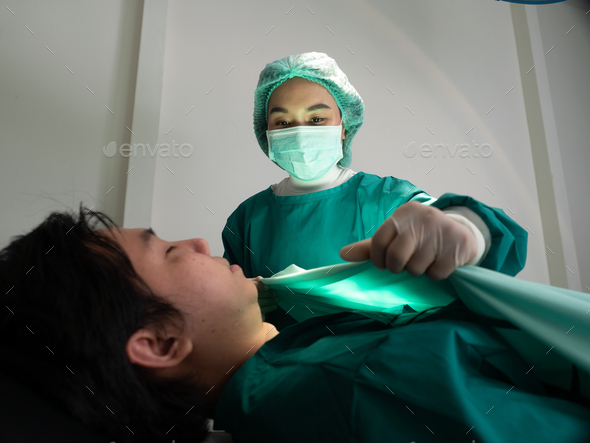 In hospital emergency room doctor use defibrillator shocking but ...