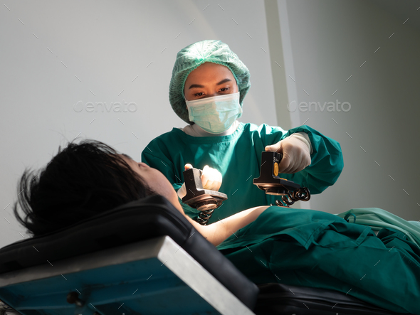 In hospital emergency room doctor shocking the heart use defibrillator ...