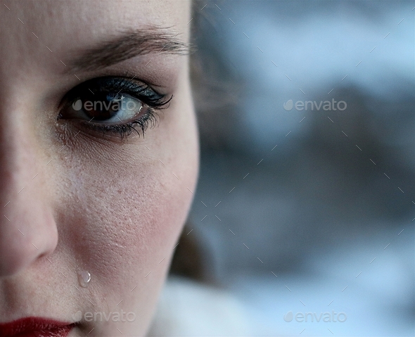 Raw Emotion: Minimal face of woman with tear running down face. Stock ...