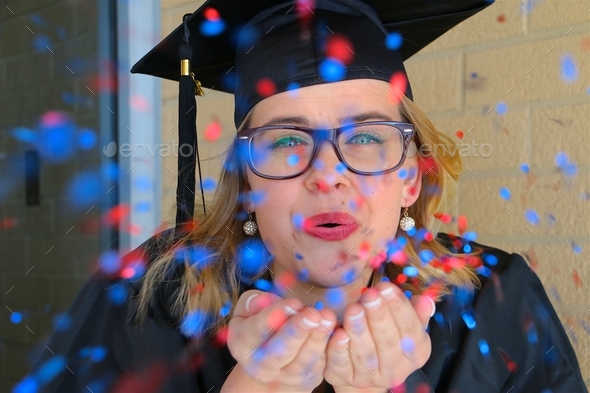 Graduation Celebration: High school graduate wearing graduation cap ...