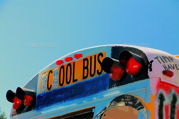 Minimalist background of COOL school bus against blue sky. Stock Photo ...