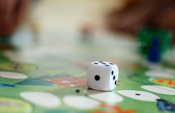 Dice in a children's board game Stock Photo by nikitavas | PhotoDune