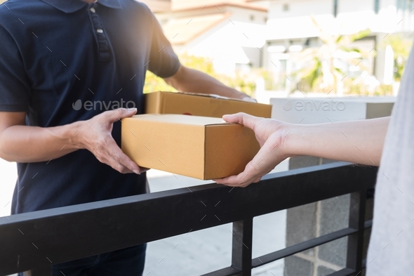 delivery service concept, customer hand receiving a cardboard boxes ...