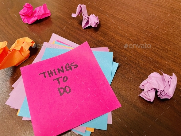 Bright, colorful stacked sticky notes of Things To Do, and things ...