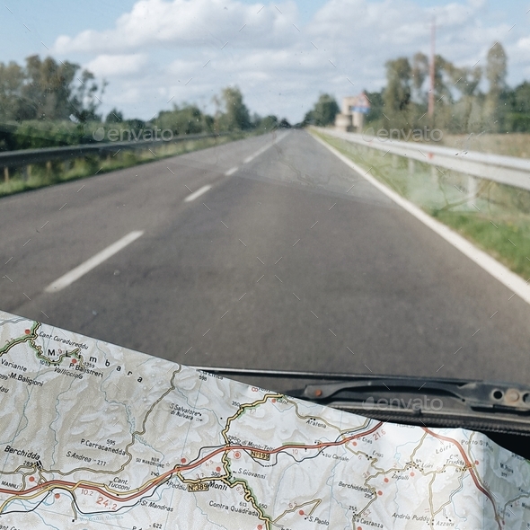 Driving the car using a paper map Stock Photo by rattodisabina | PhotoDune