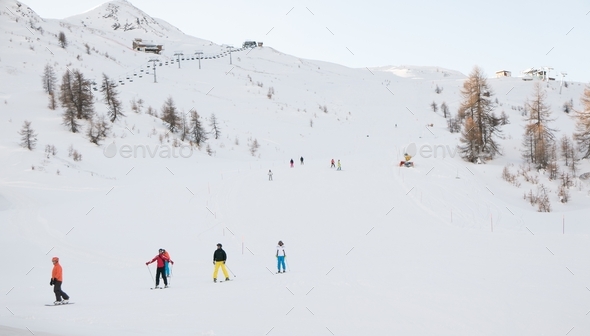 skiing on the slope over italian alps Stock Photo by rattodisabina