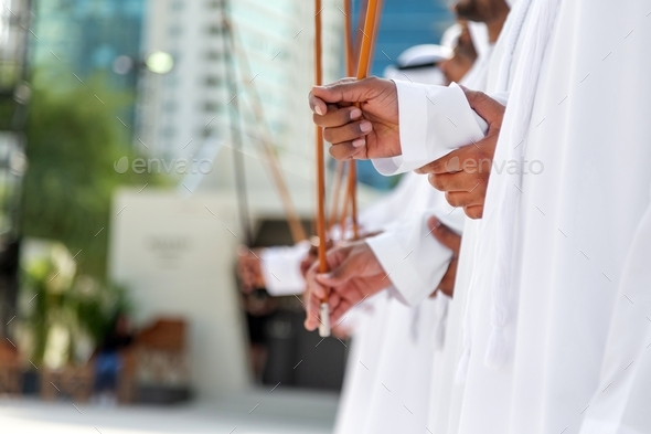 Traditional Emirati Al Ayalah male dance, UAE heritage, hands in frame ...