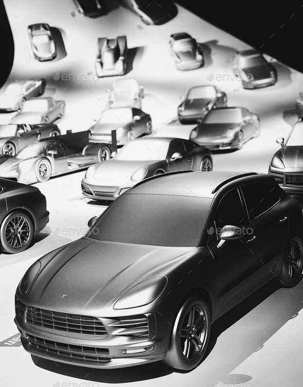 Tiny car models of the brand Porsche driving down a white road Stock ...