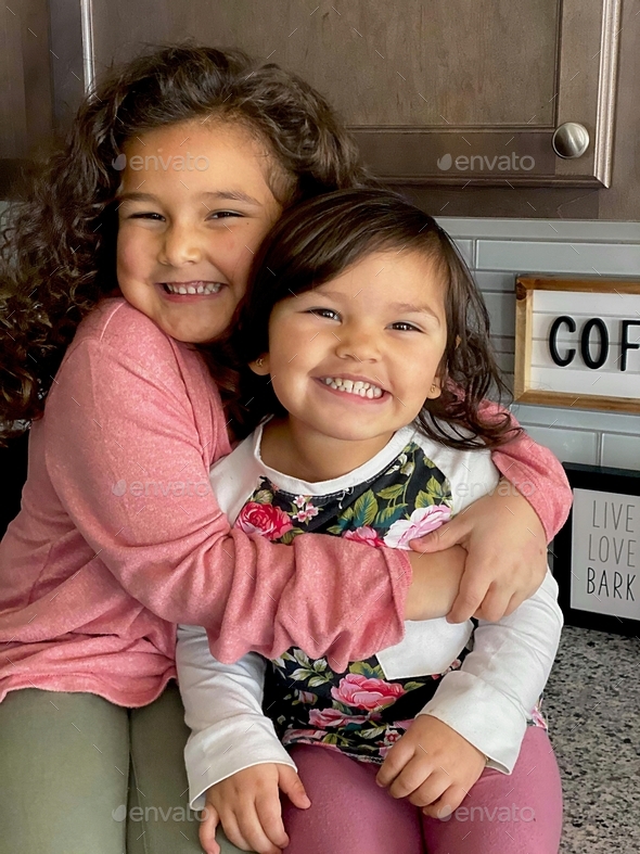 Two sisters smiling and hugging Stock Photo by marn123424 | PhotoDune