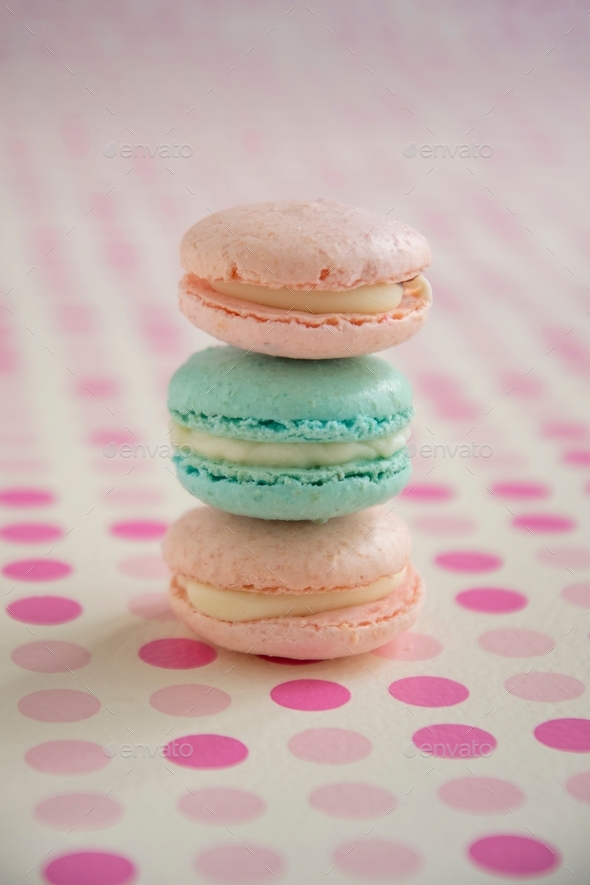 Three Macarons in a stack on a pink background Stock Photo by ...