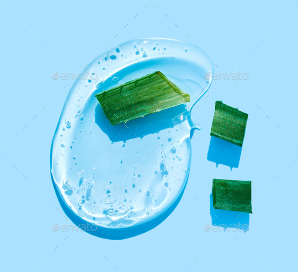 aloe vera on blue background cosmetic sample serum gel smear top view ...