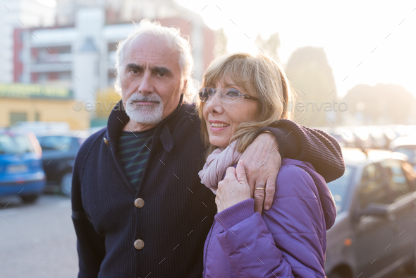 Lovely senior adult married couple outdoors hugging having fun Stock ...