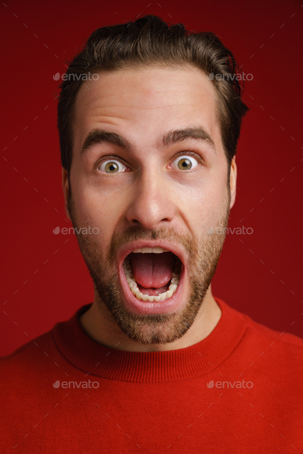 Young bristle man expressing surprise while screaming at camera Stock ...