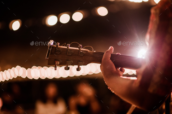 Musicians playing guitar at music festivals, lights, music, concerts ...