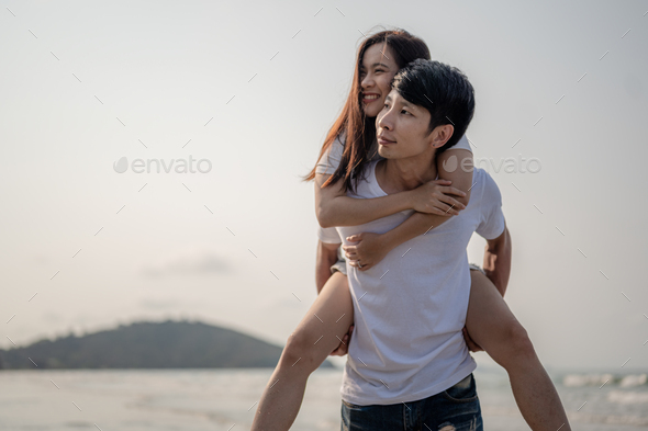 Young couple in love on beach summer vacations. Joyful girl on young ...