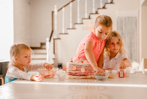 Kids making birthday cake at home Stock Photo by Lena_May | PhotoDune