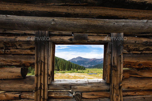 Mountain landscape through a window from an old cabin Stock Photo by ...