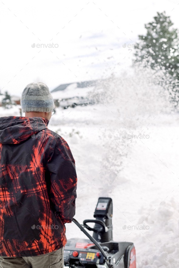 Man using snowblower to remove snow Stock Photo by takemewu31 | PhotoDune