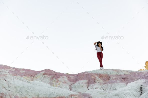 Girl posing standing on top of rock formations Stock Photo by takemewu31
