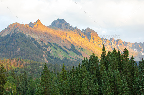 Sun hitting a mountain peak Stock Photo by takemewu31 | PhotoDune