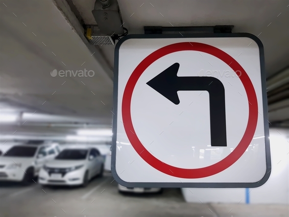 Close-up Turn Left Traffic Arrow Sign at the Parking Lot Stock Photo by ...